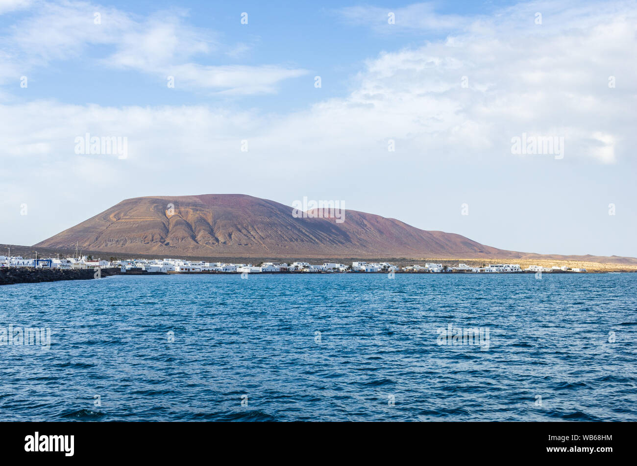 Landscape of Caleta de Sebo, La Graciosa island with volcano in ...