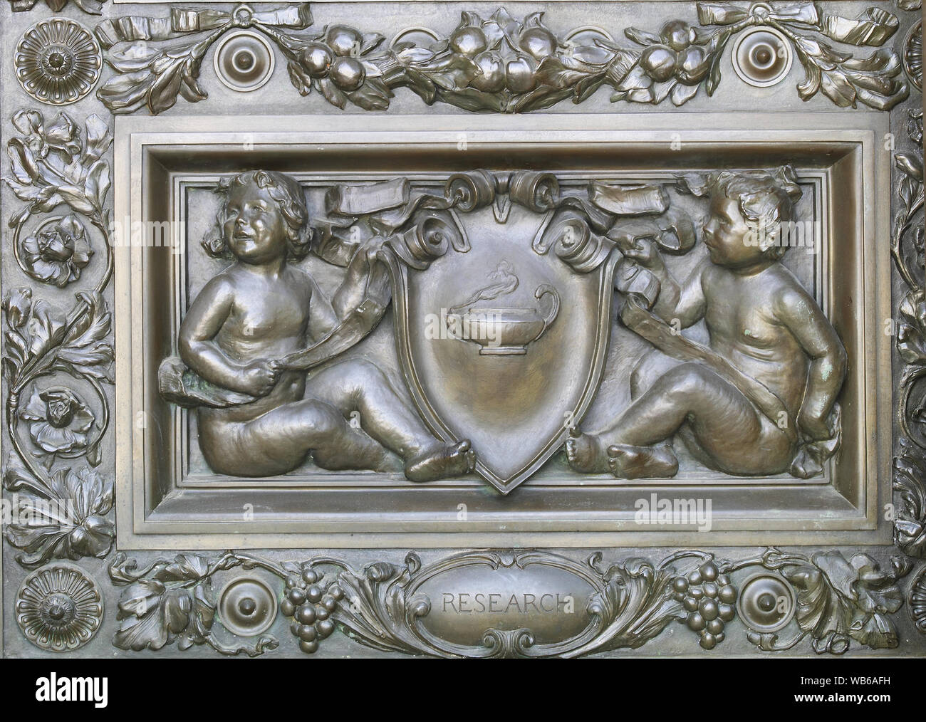 Exterior view. Detail of bronze main entrance doors labelled Research ...