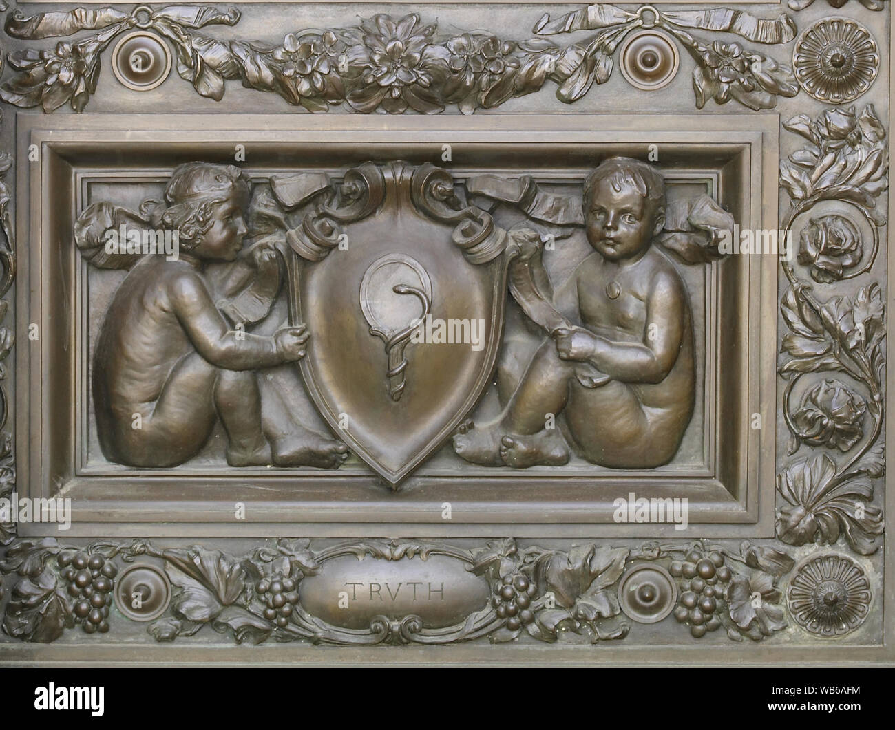 Exterior view. Detail of bronze main entrance doors labelled Truth ...