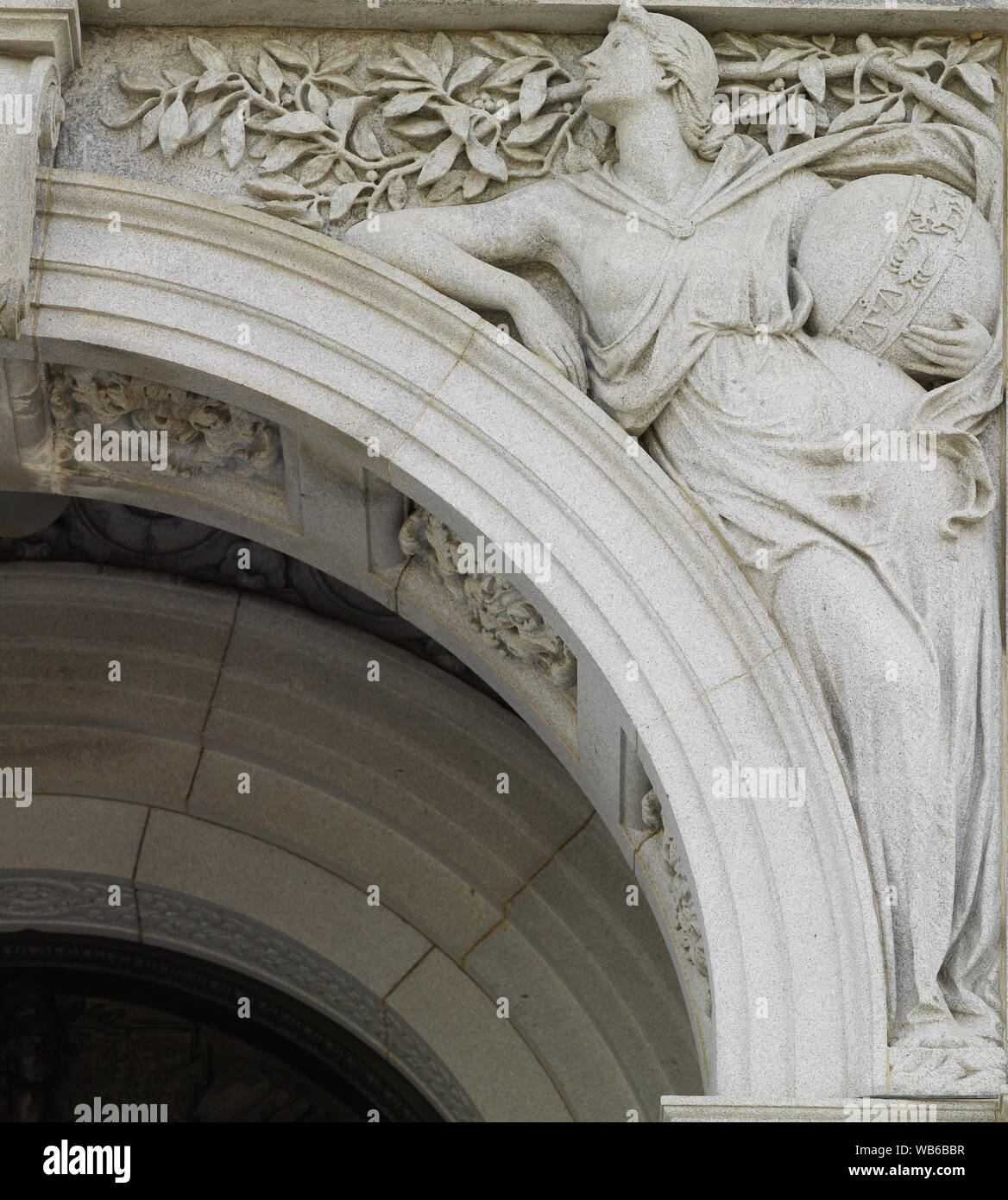 Exterior view, entrance porch. Granite sculpture with female figure ...