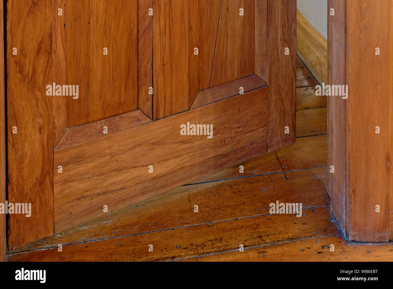 A wooden door is open just a crack, making you wonder what is behind it ...