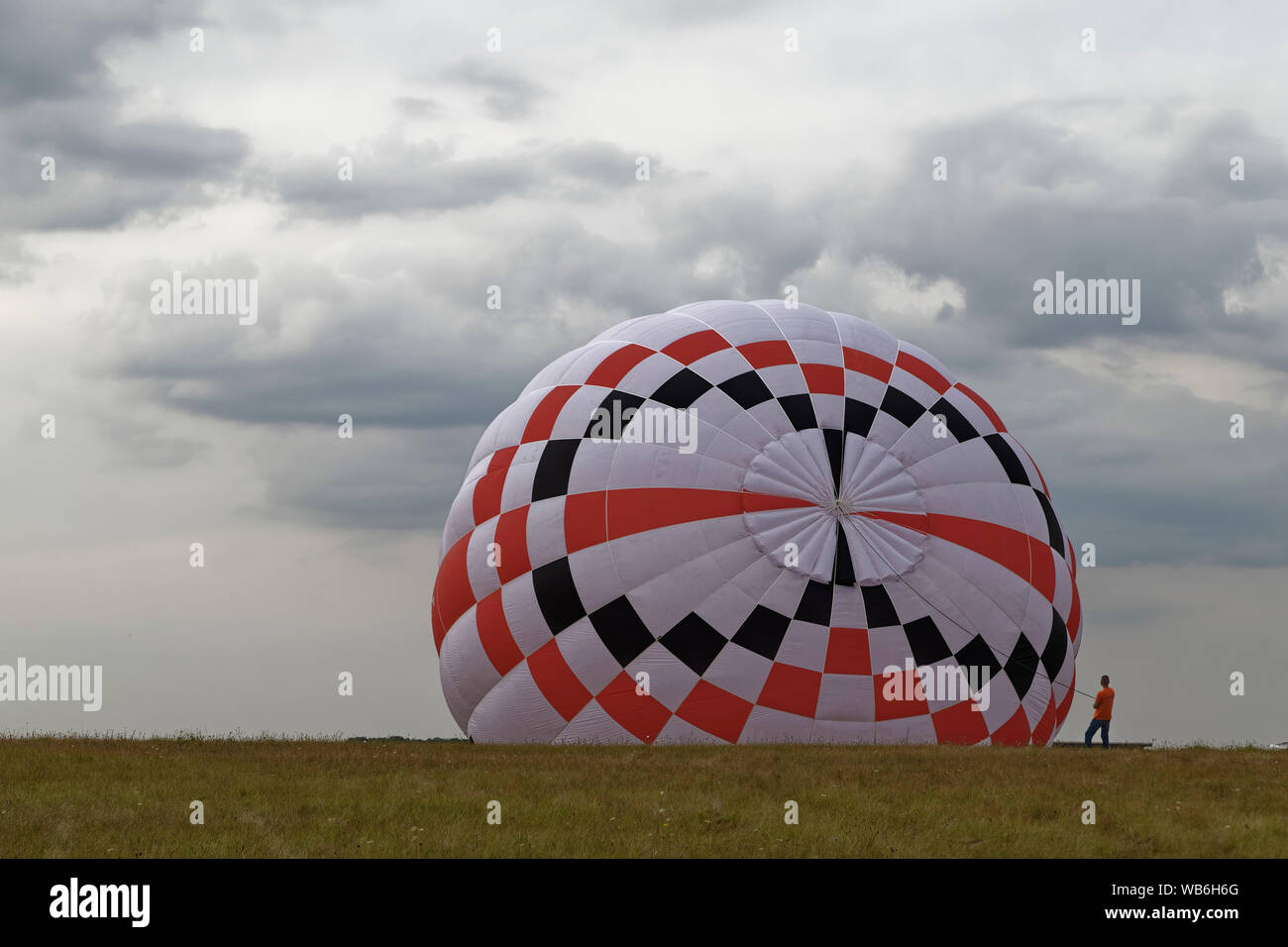 Chambley, France. 3rd August, 2019. Inflating a hot air balloon before ...
