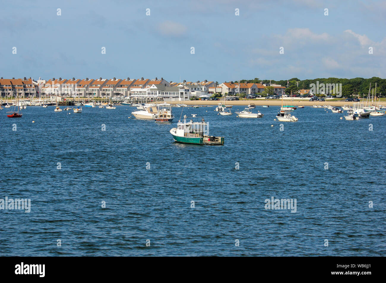 Boats on Lewis bay, Yachtsman Condominiums in the background, Hyannis ...