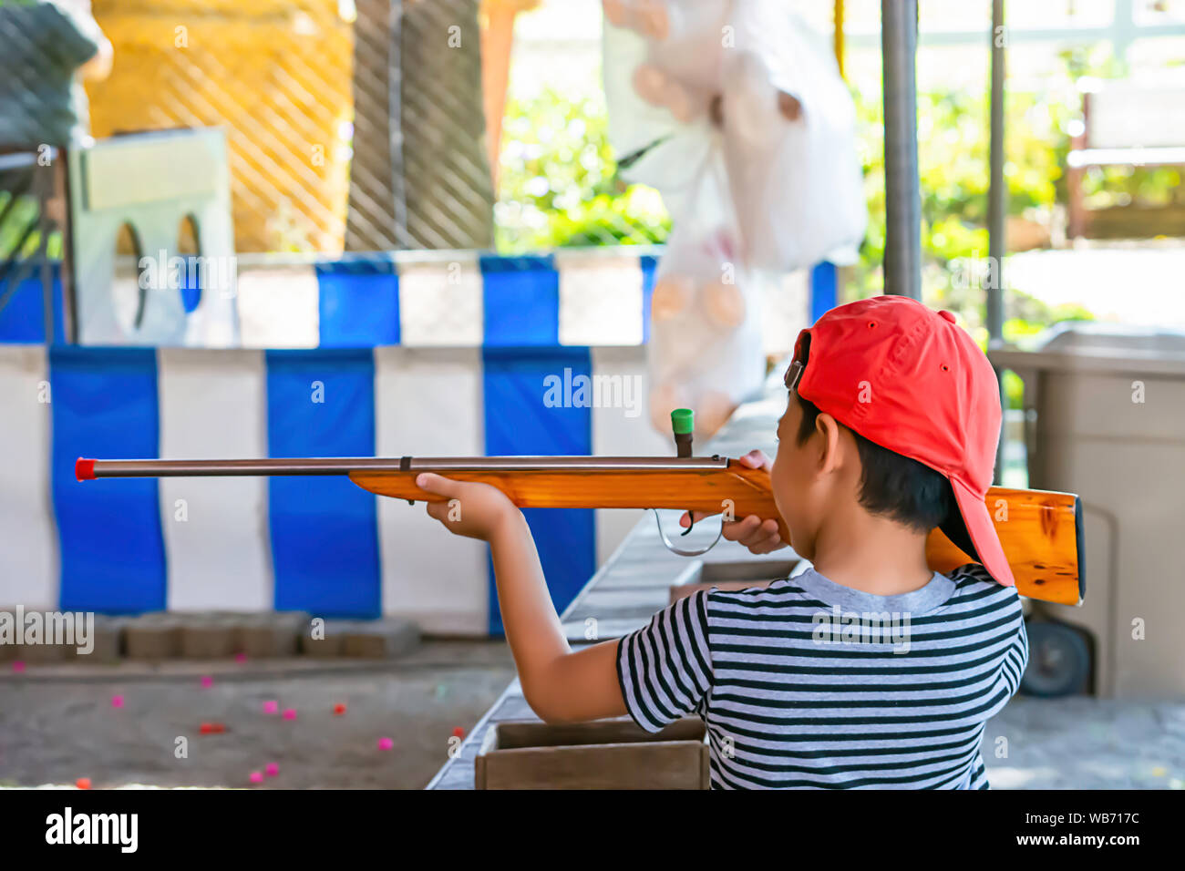 Boys holding gun hi-res stock photography and images - Alamy