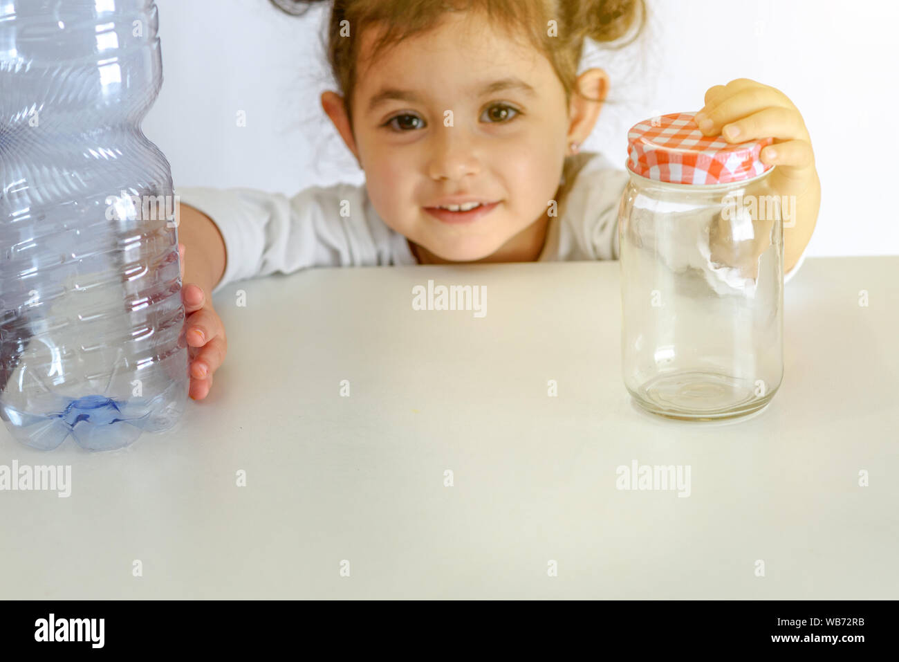 Child pushing the plastic bottle, holding glass jar. No to Plastic ...