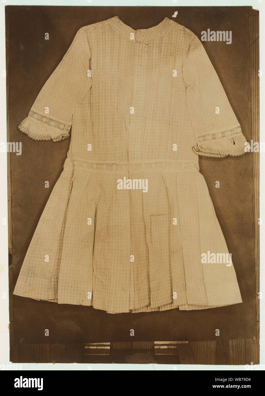 Finished garment. Abstract: Photographs from the records of the ...