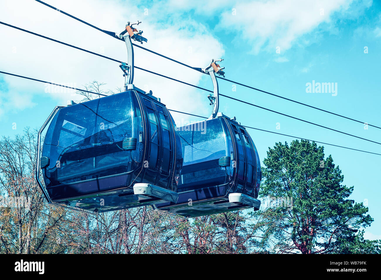 Cable cars moving at the ropeway. Toned Stock Photo - Alamy