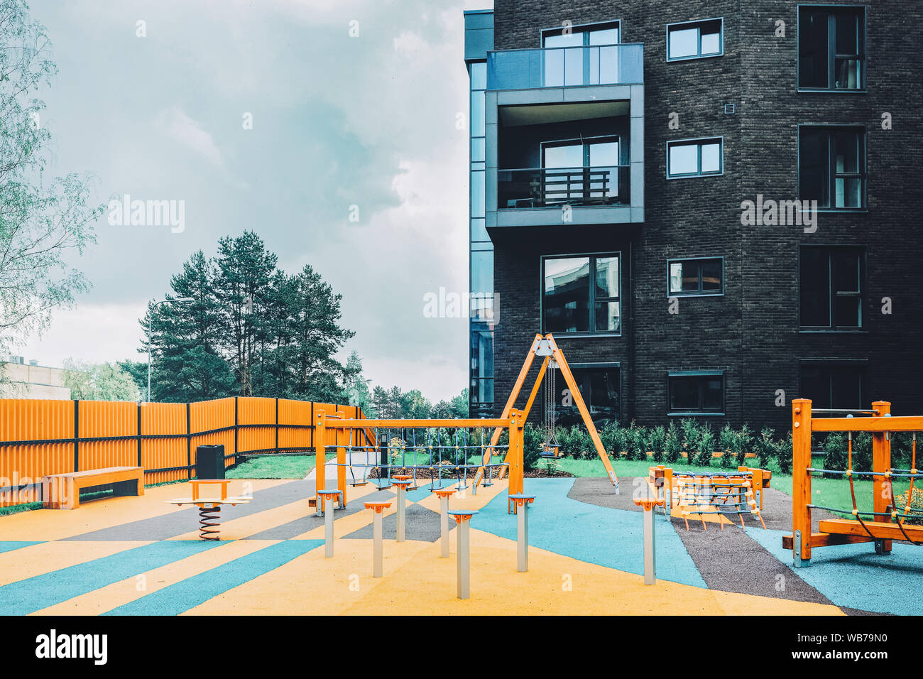 Children playground and modern complex of apartment residential ...