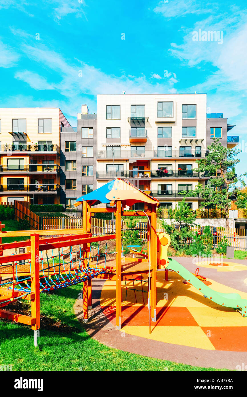 Children playground at complex of apartment building quarter. And ...