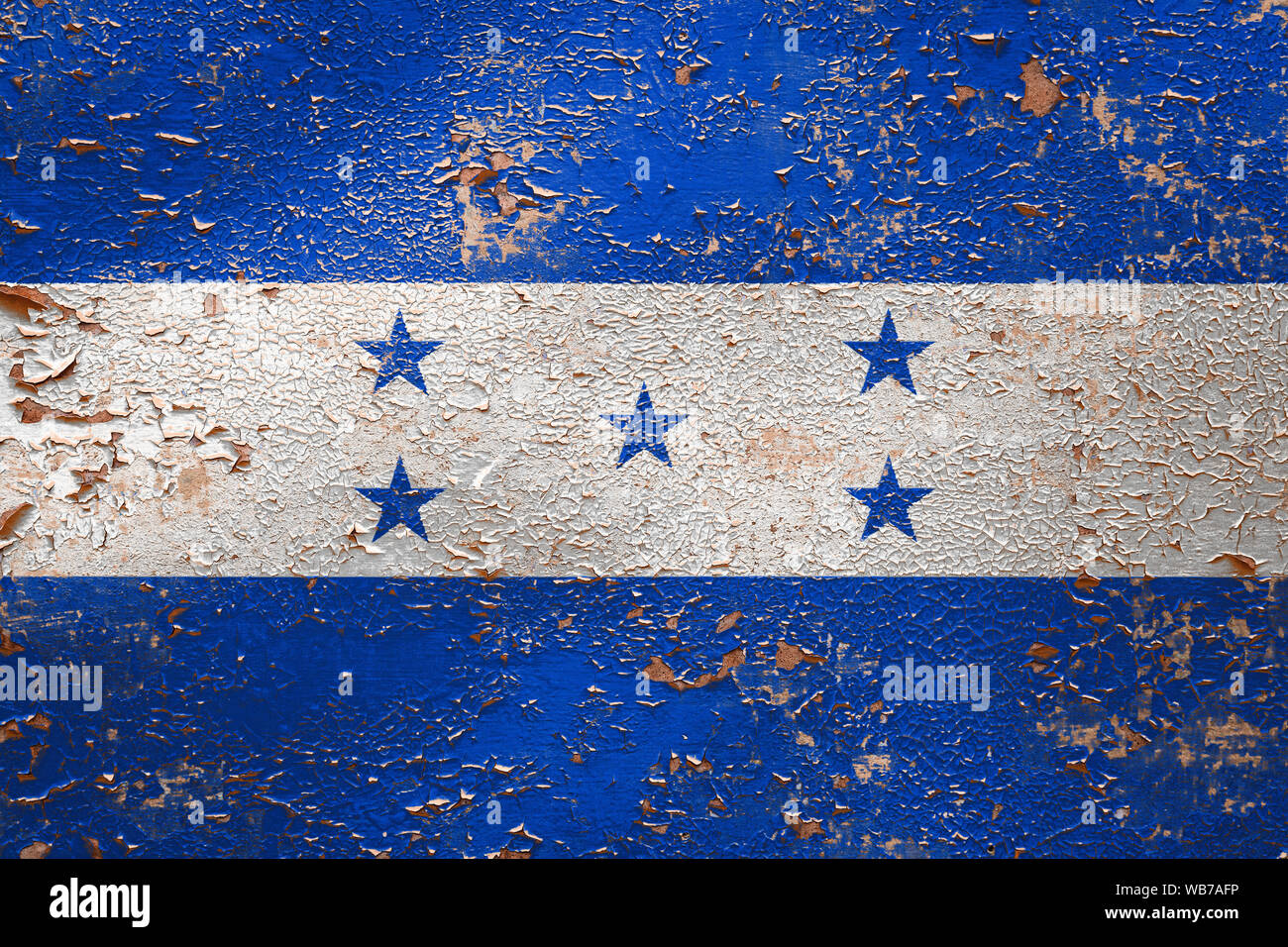 National flag of Honduras on old peeling wall background.The concept of ...