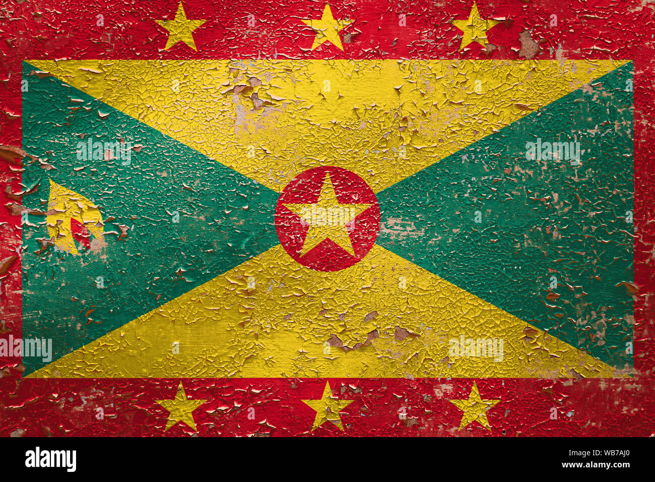 National flag of Grenada on old peeling wall background.The concept of ...