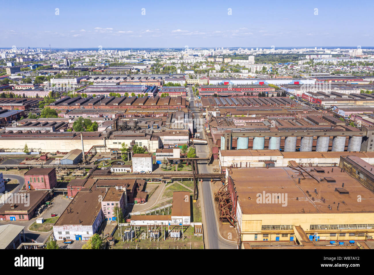 aerial view of industrial district with manufacturing buildings and ...