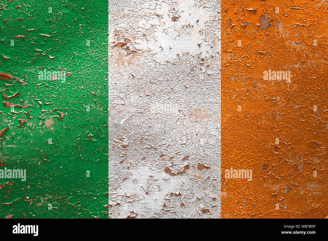 National flag of Ireland on old peeling wall background.The concept of ...
