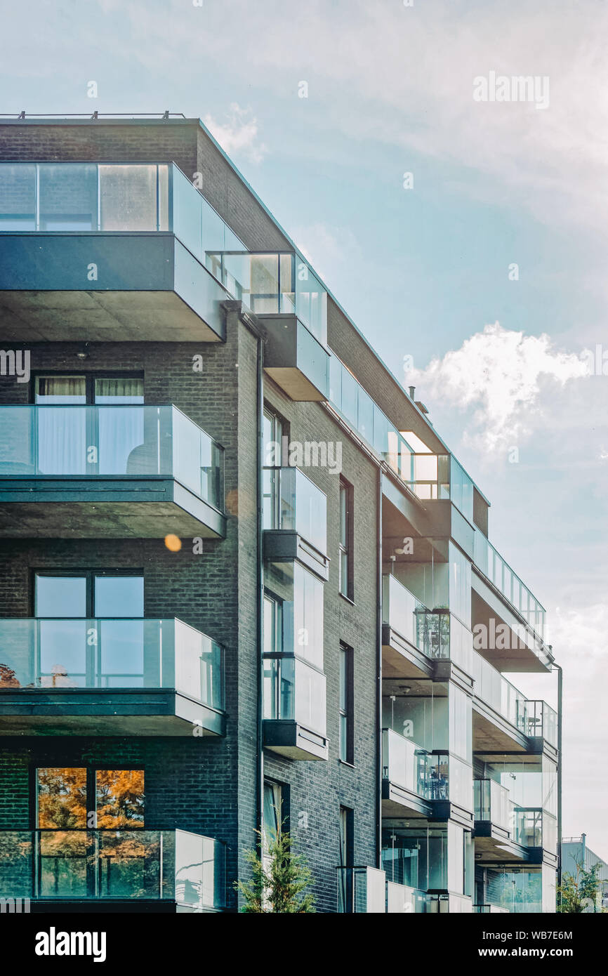 Fragment of Modern glass architecture of residential building. And ...