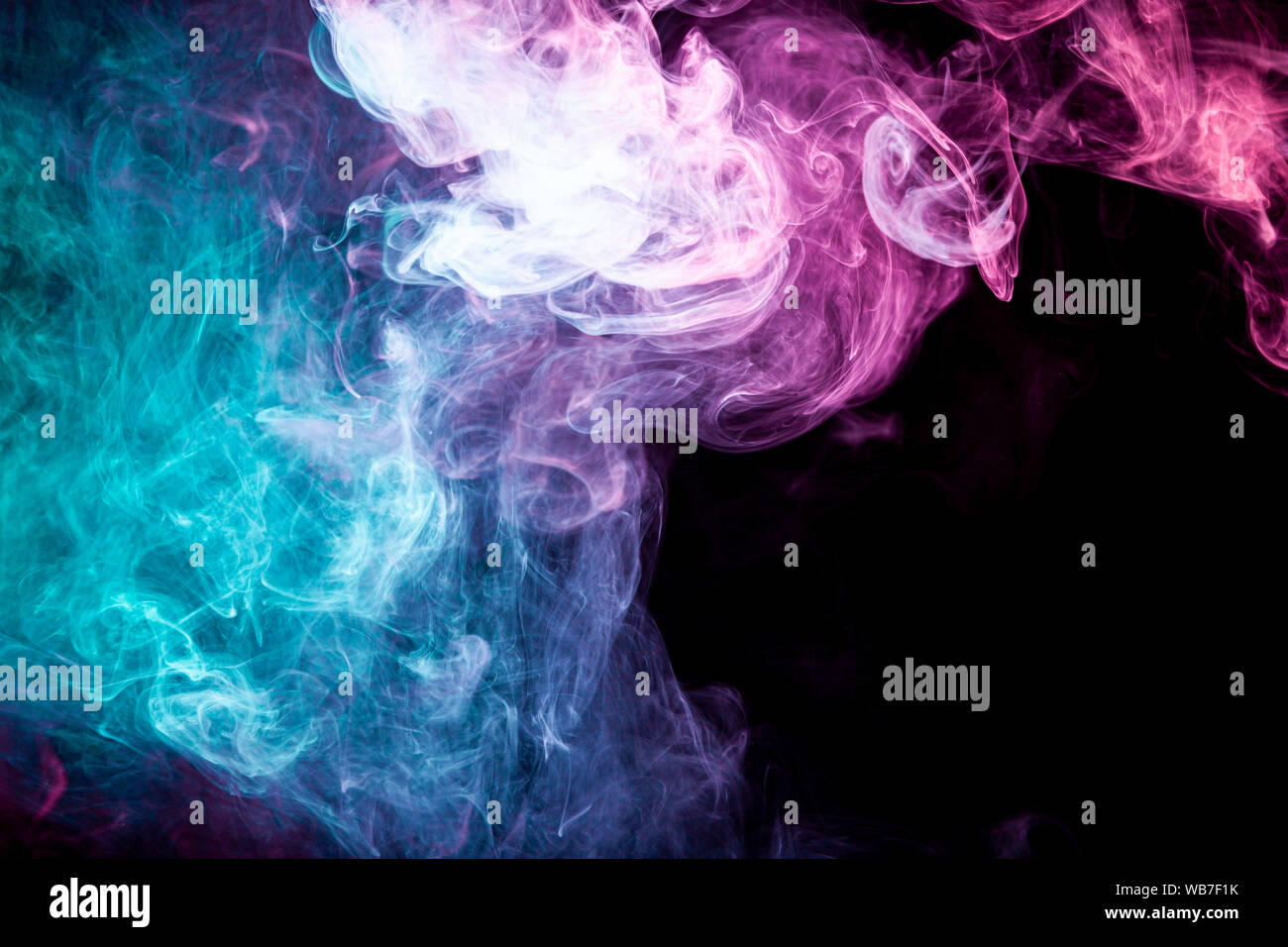 Toxic movement of color smoke abstract on black background, fire design ...