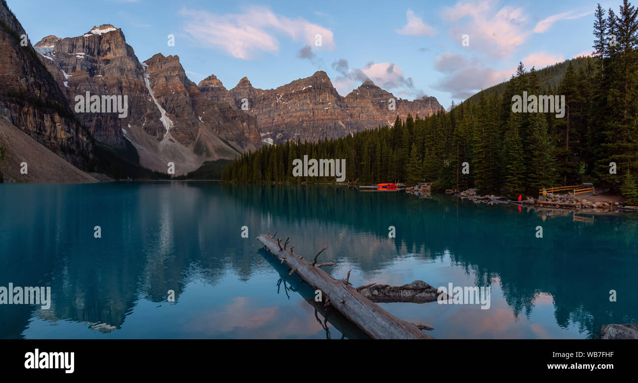 Beautiful view of an Iconic Famous Place, Moraine Lake, during a vibrant summer sunrise. Located ...
