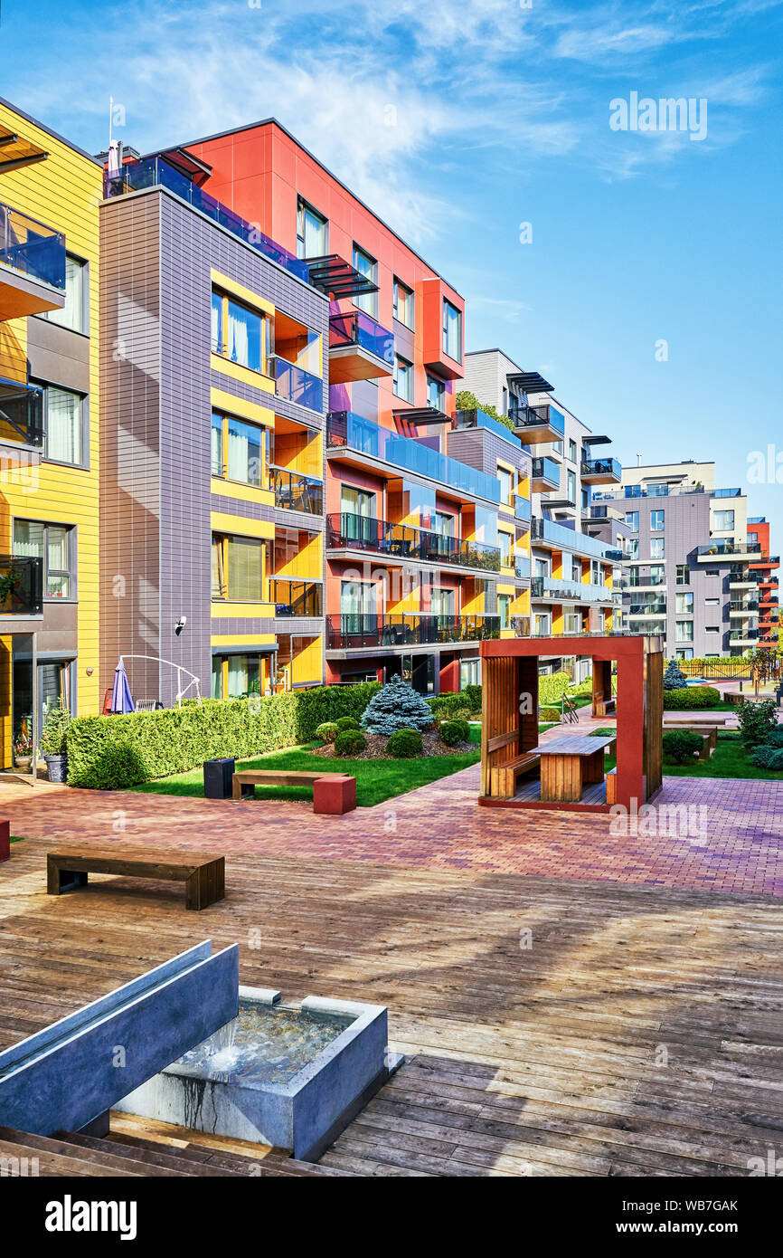 Modern complex of apartment residential buildings with outdoor fountain ...