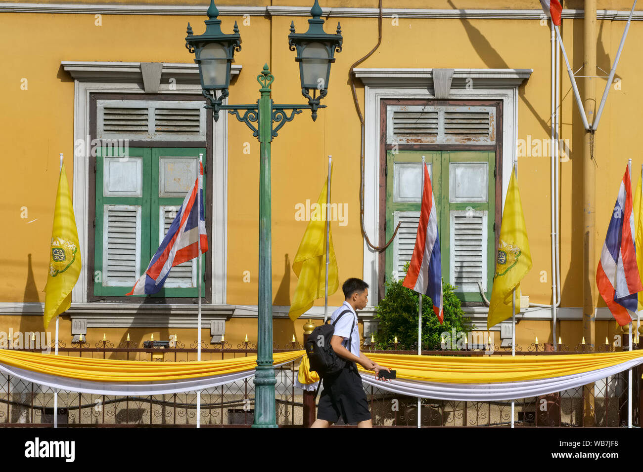 A student passes Suankularb Wittayalai School (Suan Gularb School ...
