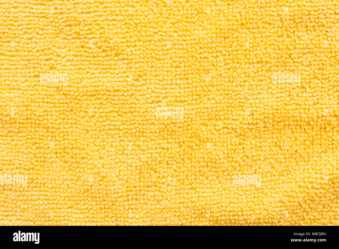 Surface of yellow microfiber cloth, macro textile pattern background ...