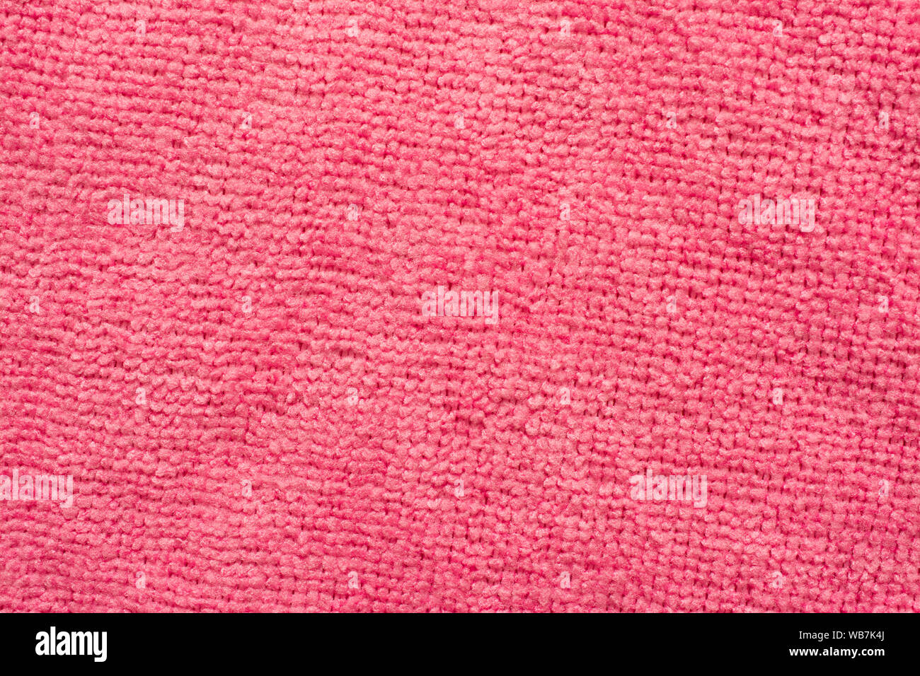 Surface of pink microfiber cloth, macro textile pattern background ...