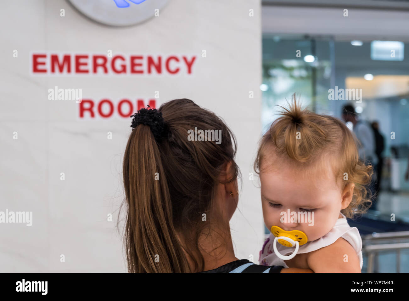 Mom and child come in in the emergency room at the hospital in Pattaya ...