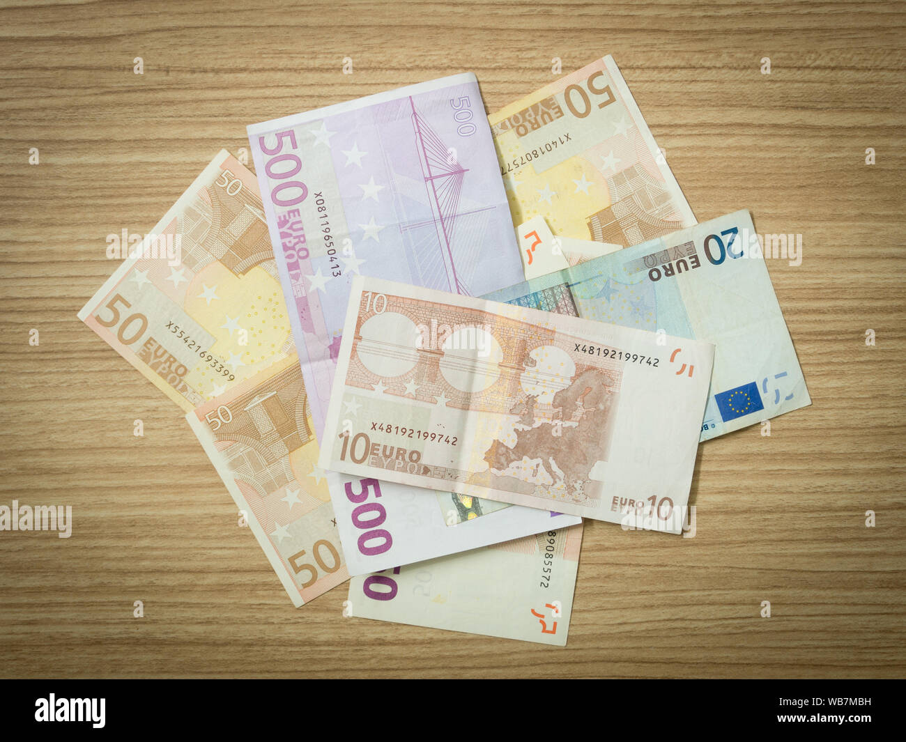 euro banknote on wood table Stock Photo - Alamy
