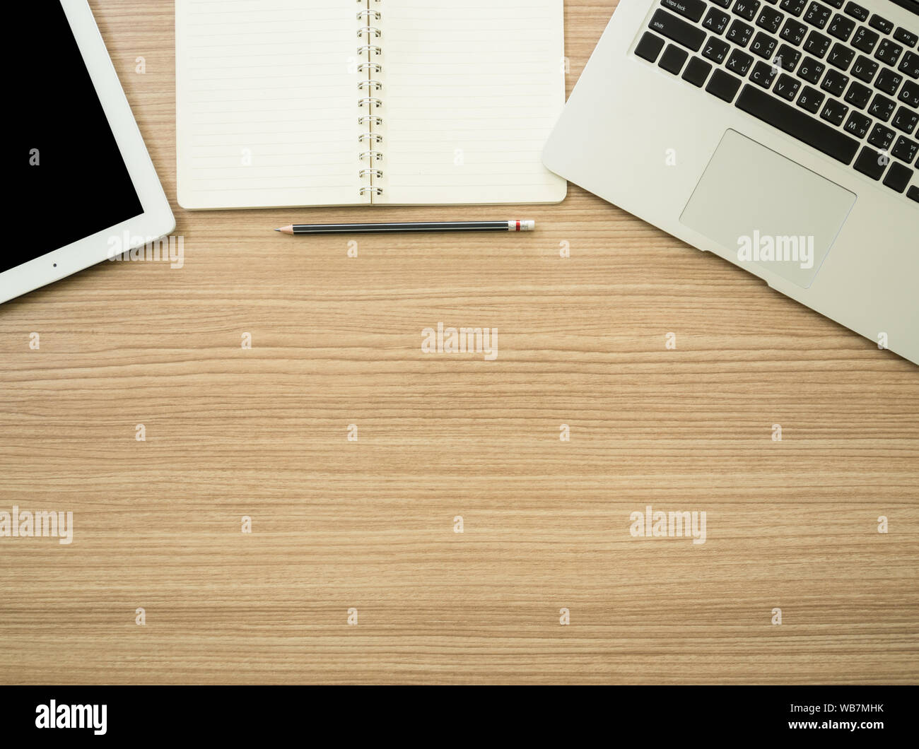 work table with computer tablet and notebook. View from above Stock ...