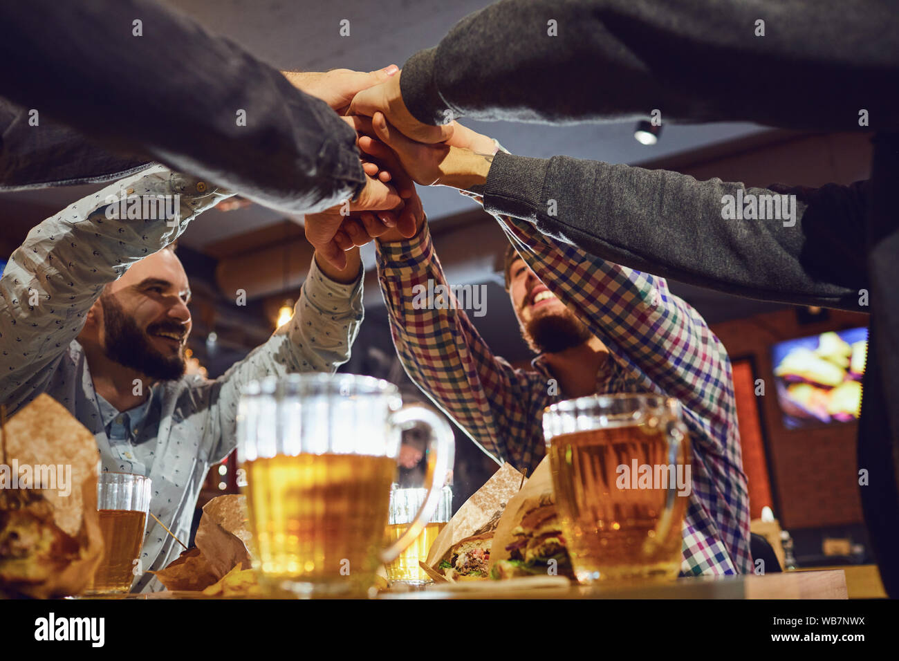 Beer friends free time concept. Cheerful friends with glasses and beer ...