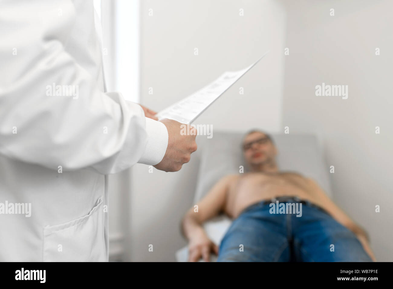 Doctor watching medical record of a patient Stock Photo - Alamy