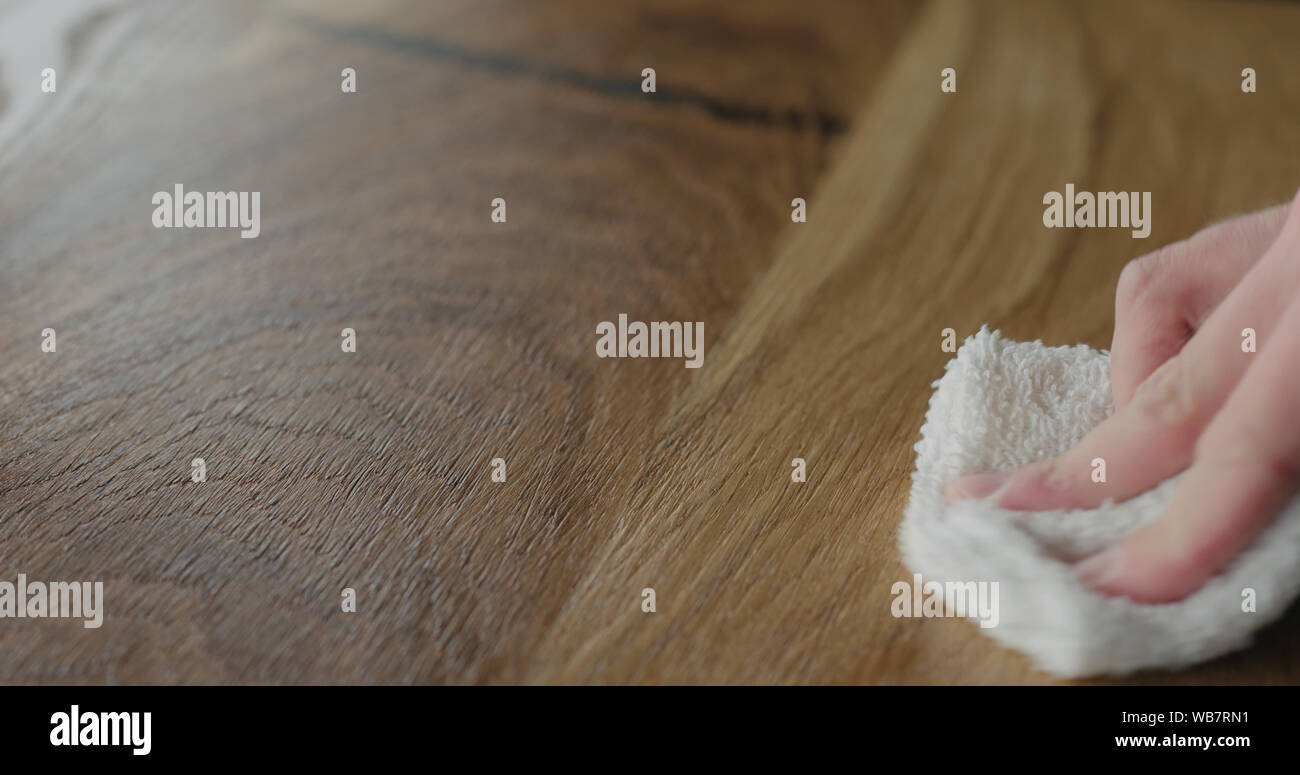 applying oil finish to oak surface with cloth, wide photo Stock Photo ...