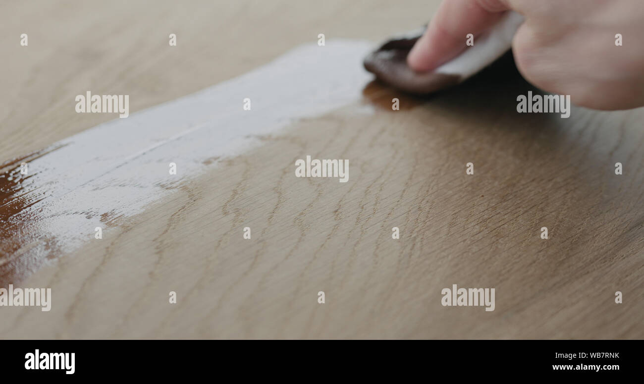 applying oil finish to oak surface with cloth, wide photo Stock Photo ...