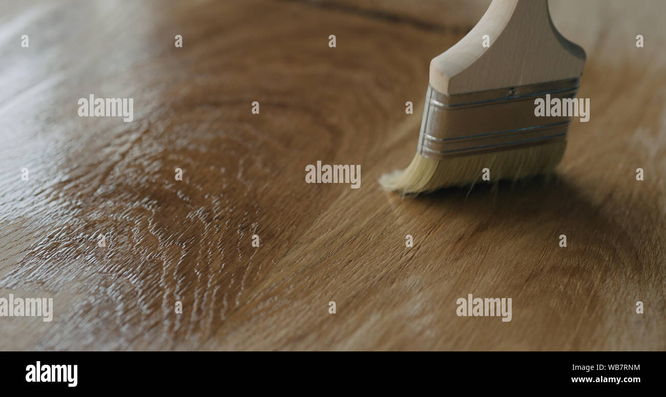 applying oil finish to oak surface with brush, wide photo Stock Photo ...