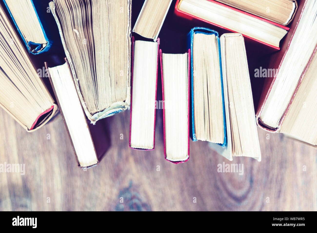 Stack of old book on wooden floor - education concept background, many ...