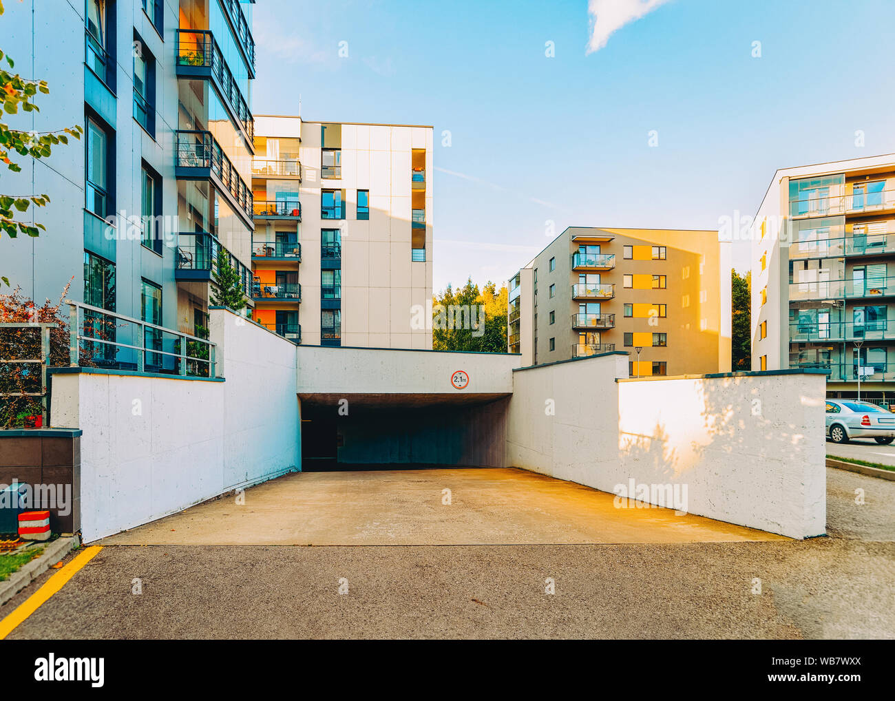 New modern residential apartment house building and garage and parking ...