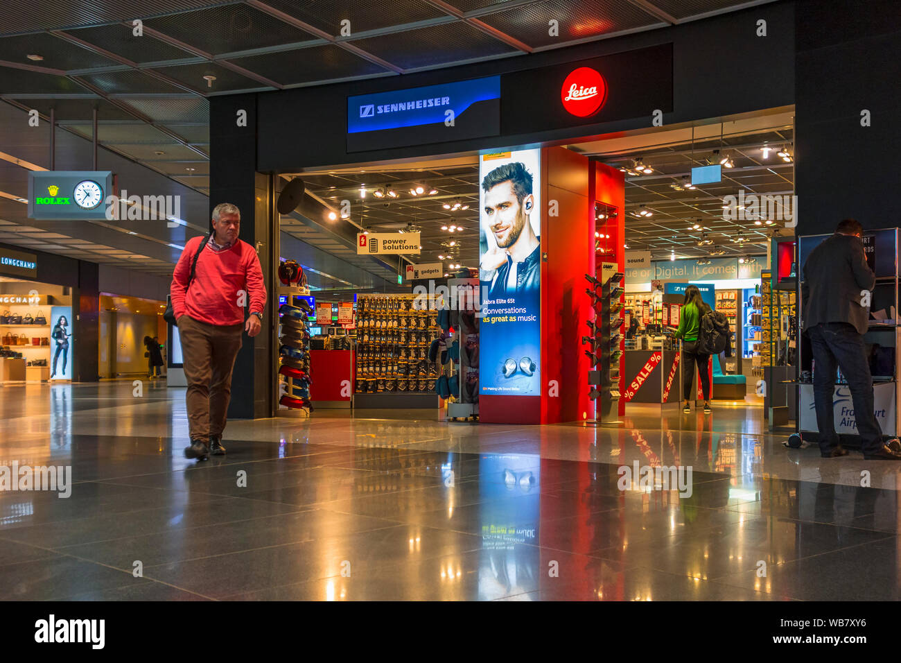 Man walking in a business mall Stock Photo - Alamy