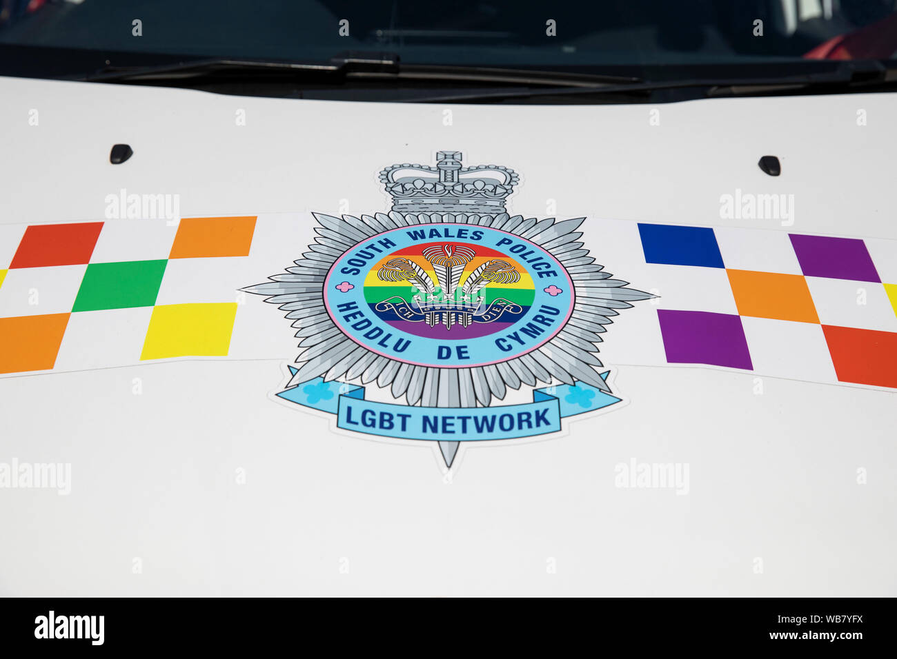 A special LGBT network South Wales Police crest on a police car bonnet ...