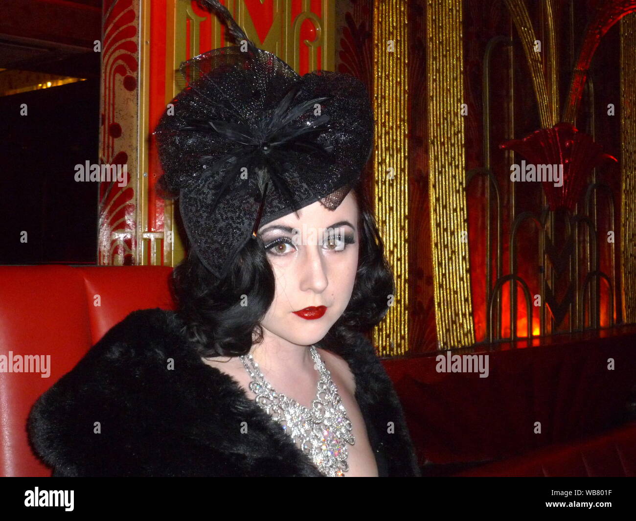 A burlesque performer relaxes in the Art Deco splender of Madam Jojo’s ...