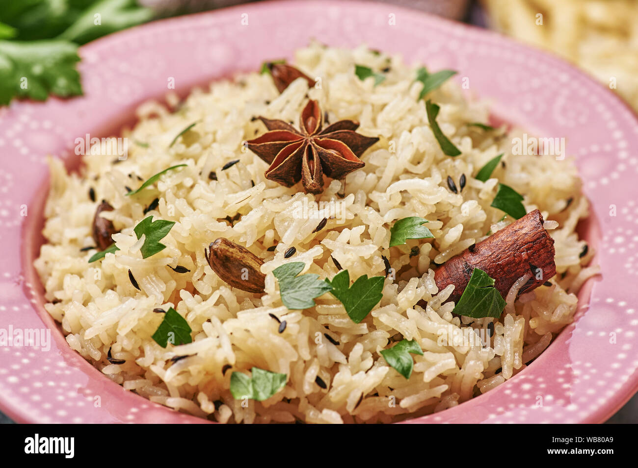 Jeera Rice in pink plate. Jeera rice - traditional indian cuisine dish ...