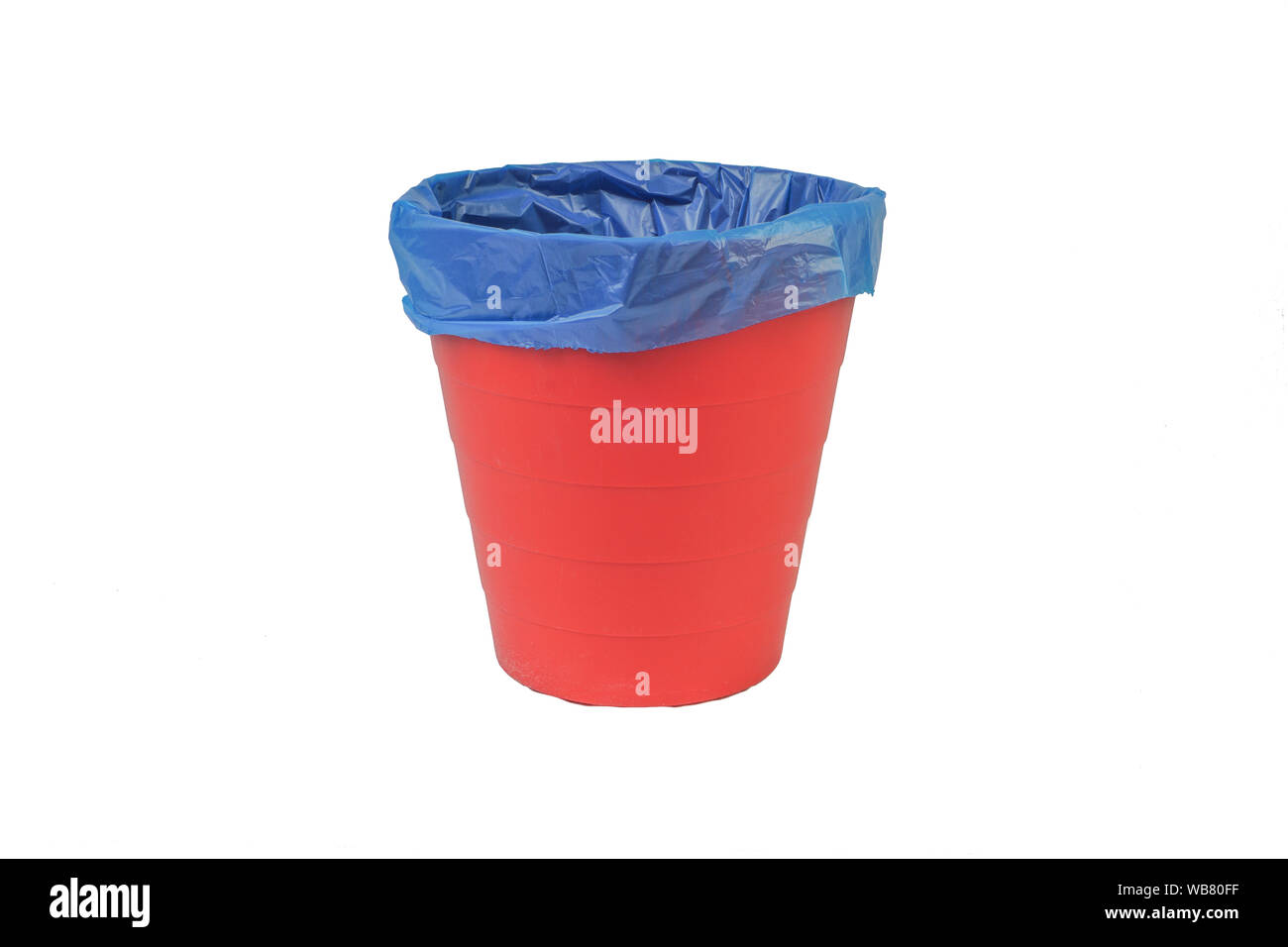 Red plastic trash or garbage bin on white background. Selective focus ...
