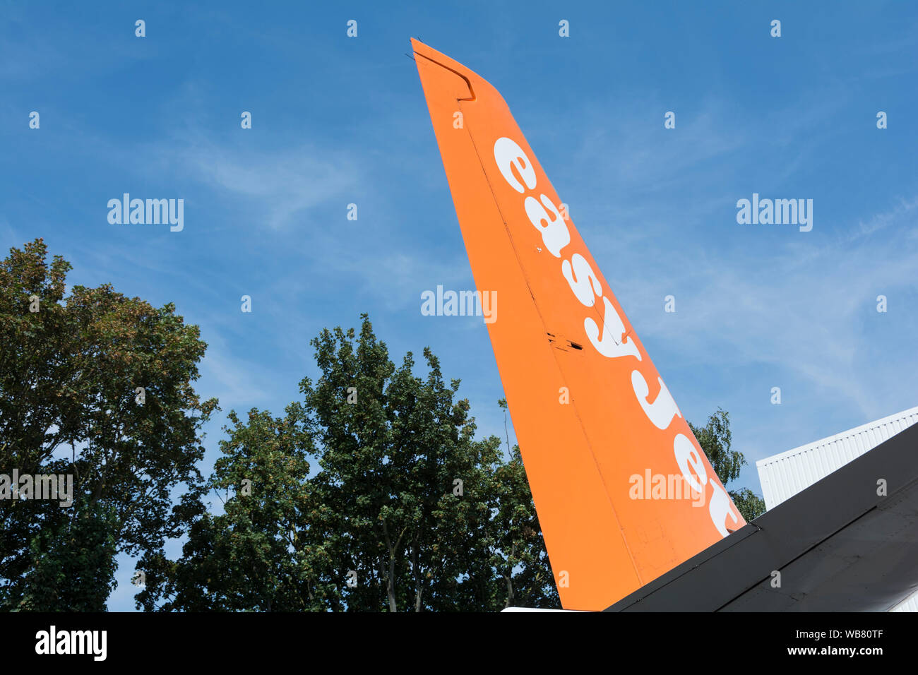 Close-up of an easyJet plane tail fin outside the easyFood and easyBus ...