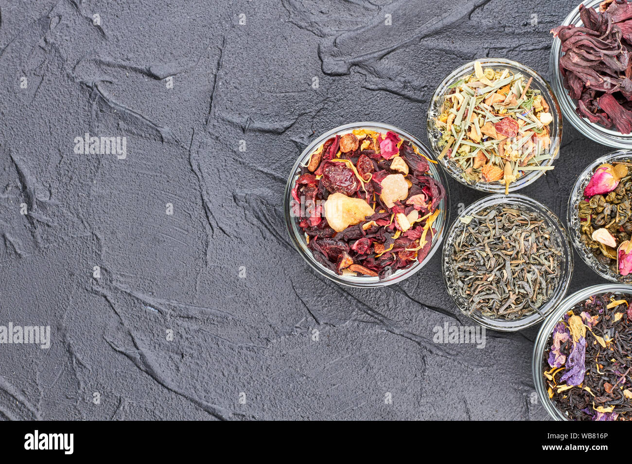 Tea types on black stone background Stock Photo - Alamy