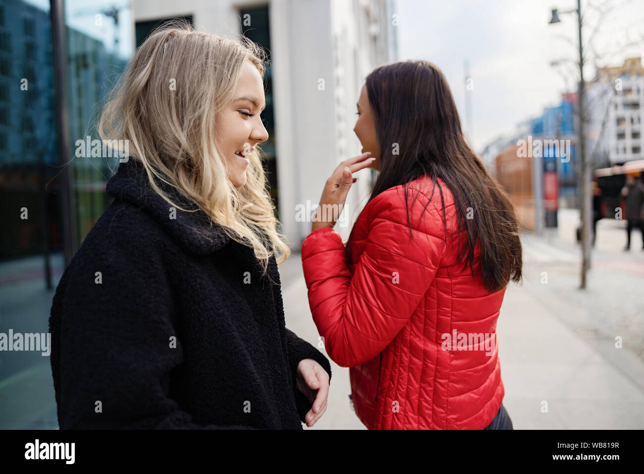 Two friends talking in street hi-res stock photography and images - Alamy