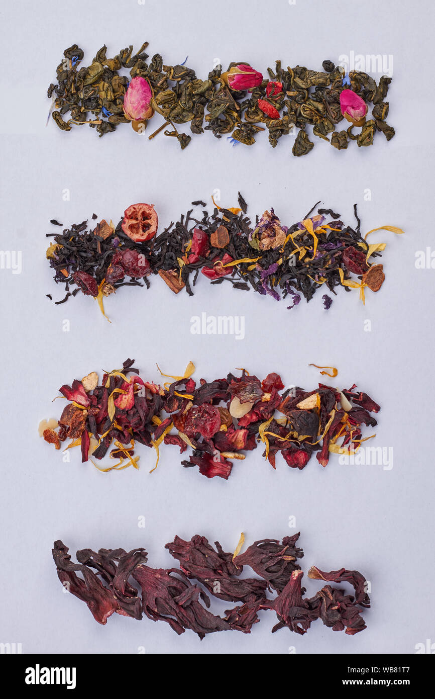 Four types of dried tea on white background Stock Photo - Alamy