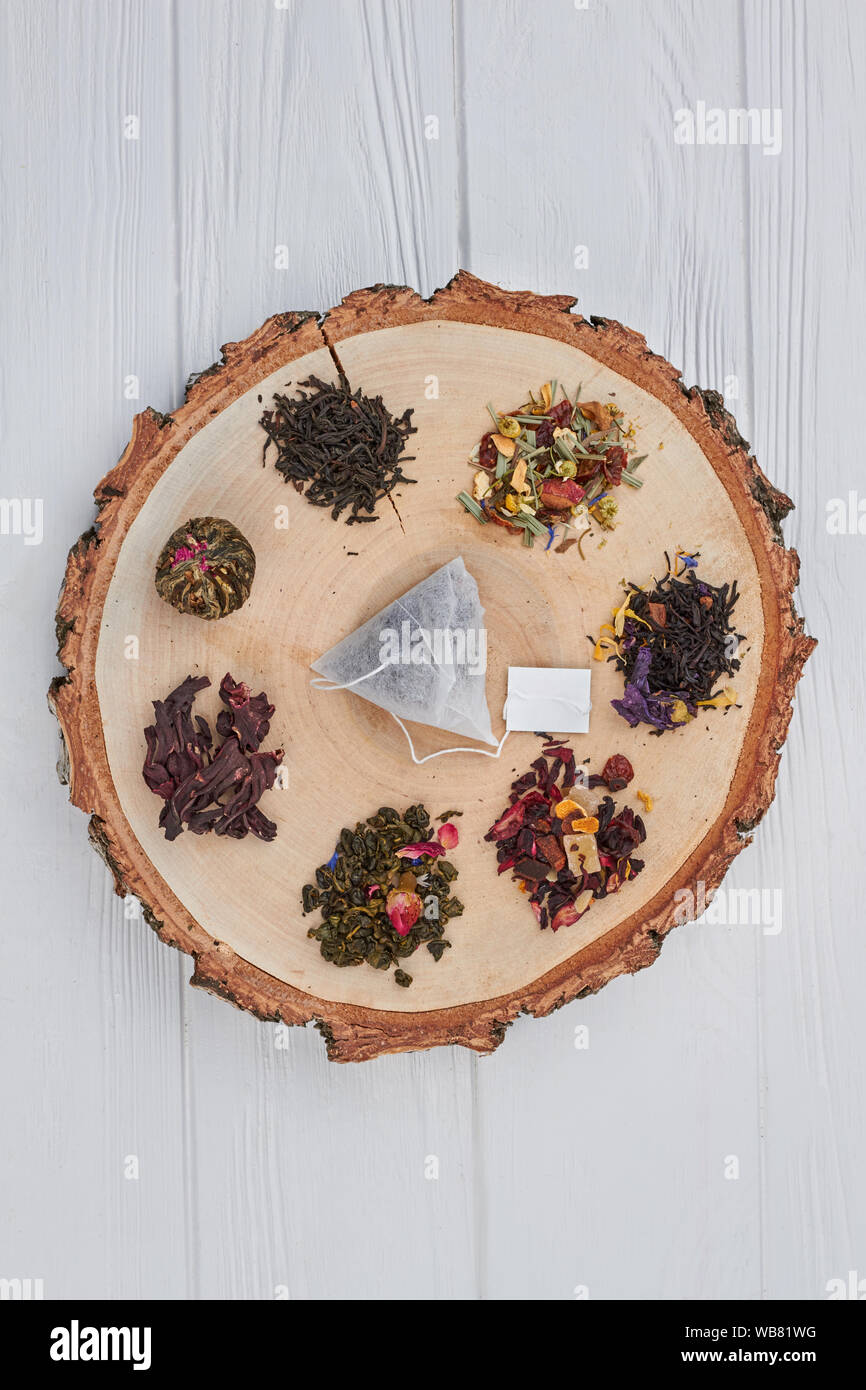 Wooden slice with dried assorted tea leaves Stock Photo - Alamy