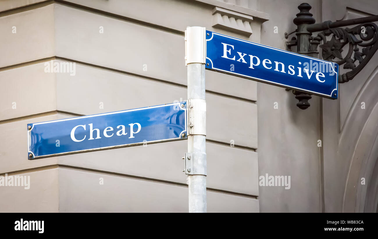 Street Sign the Direction Way to Cheap versus Expensive Stock Photo - Alamy
