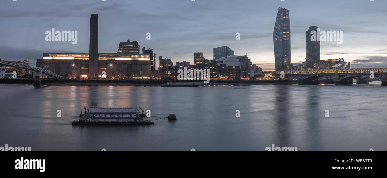 Evening in London near the riverside. Thames river and cityscape. Tate ...