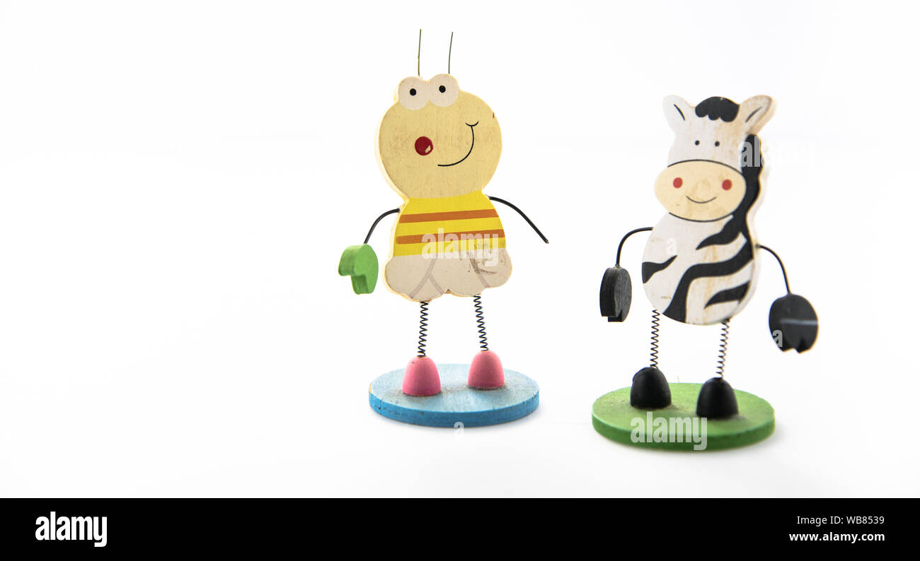 Cow and bee figures isolated on white background Stock Photo - Alamy