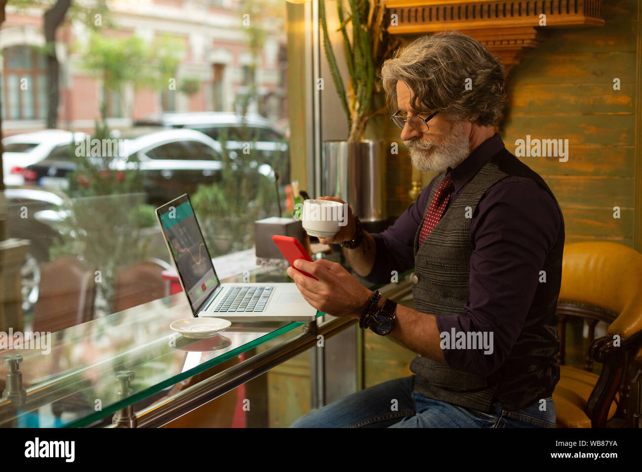 Serious man writing a message during his working day Stock Photo - Alamy