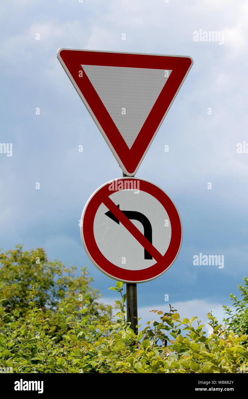 Give way and no left turn red and white signs mounted on strong metal ...