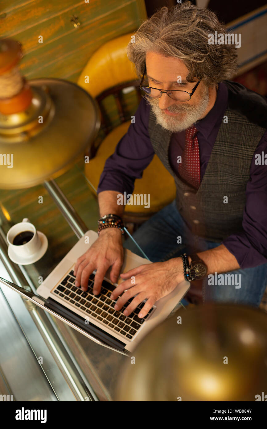 Man thinking what else to write in his article Stock Photo - Alamy
